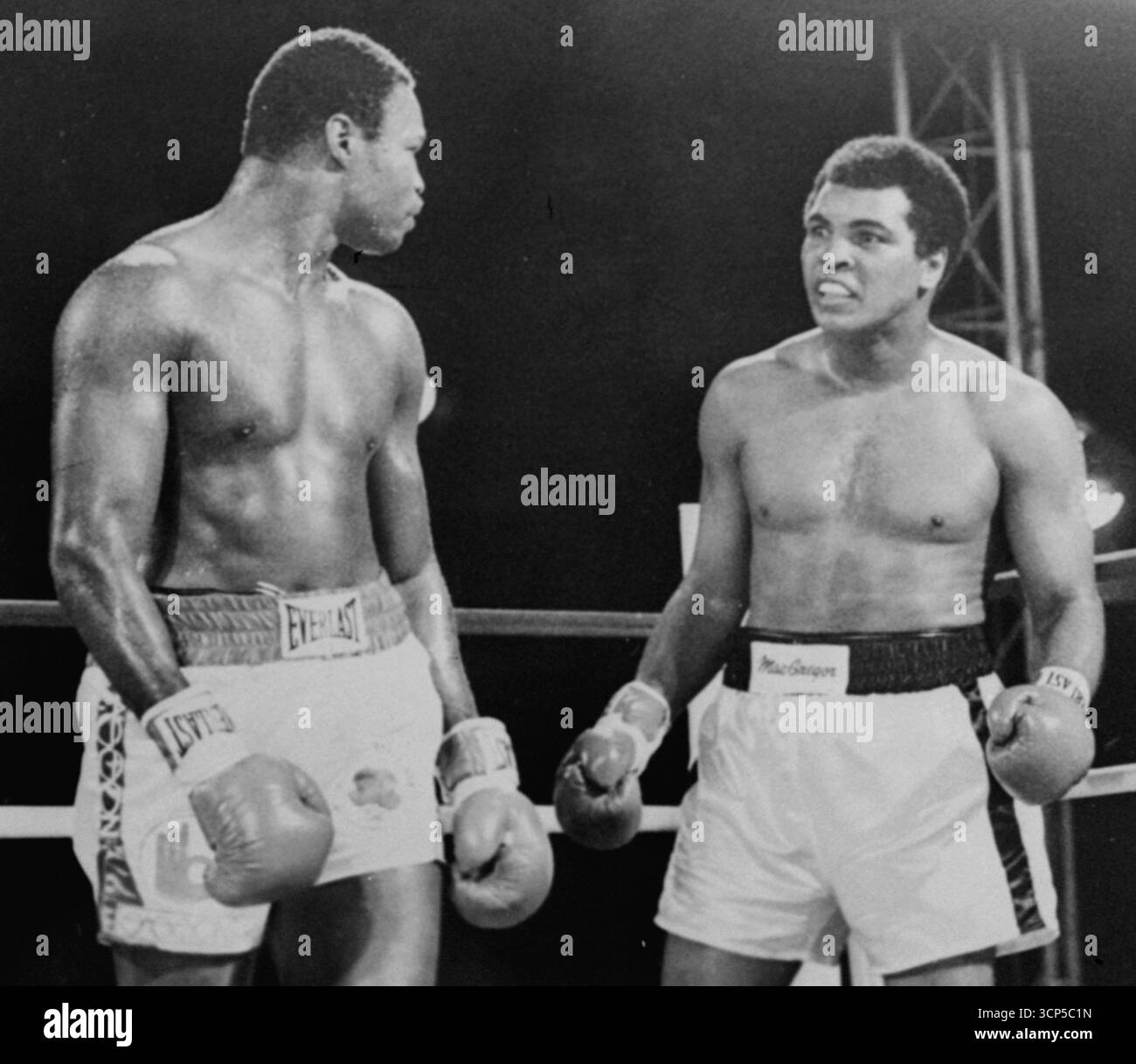 Challenger Muhammad Ali, right, gives WBC heavyweight champion Larry ...