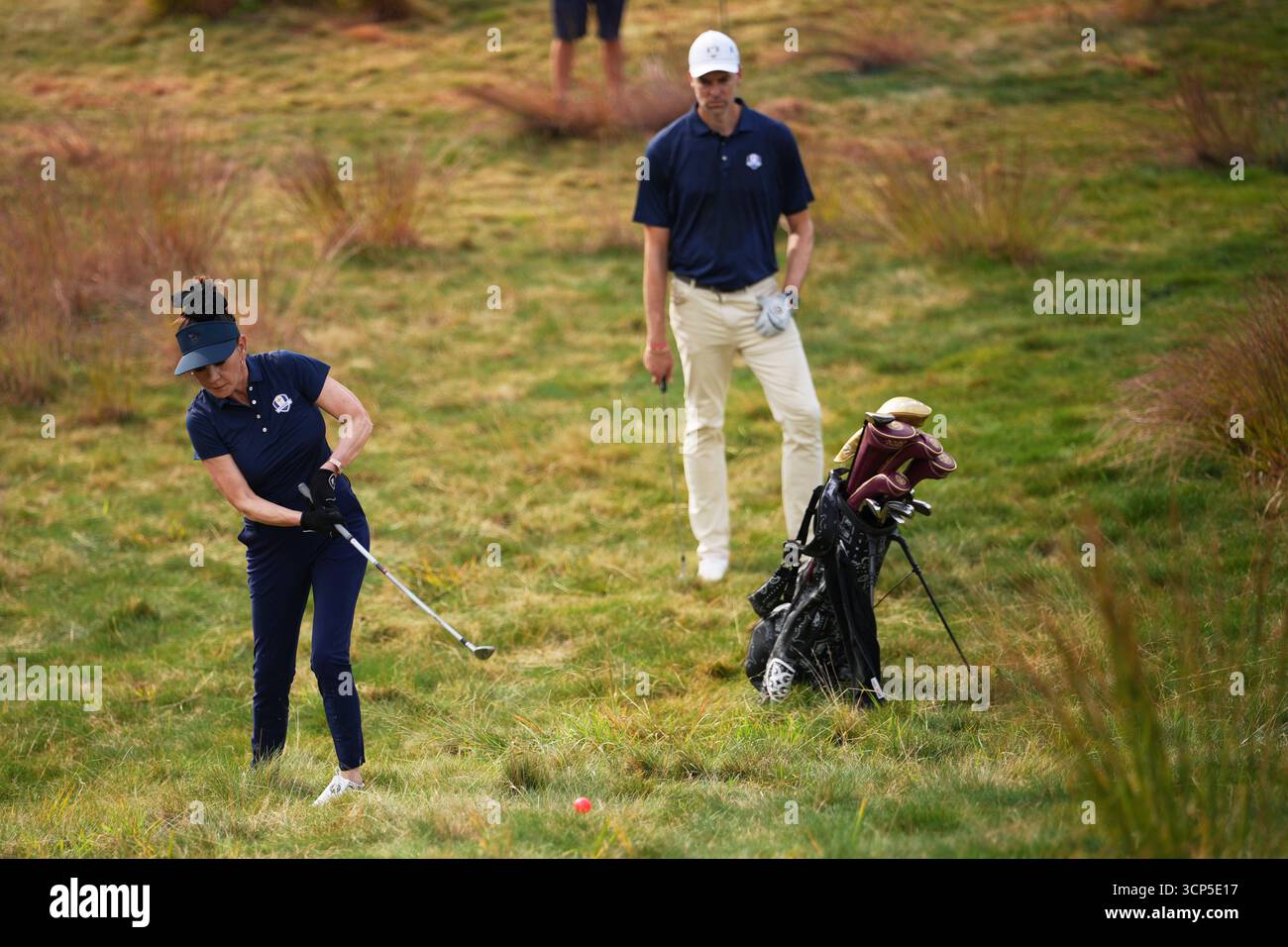Europe's Catherine Zeta-Jones hits from the rough on the fifth hole ...