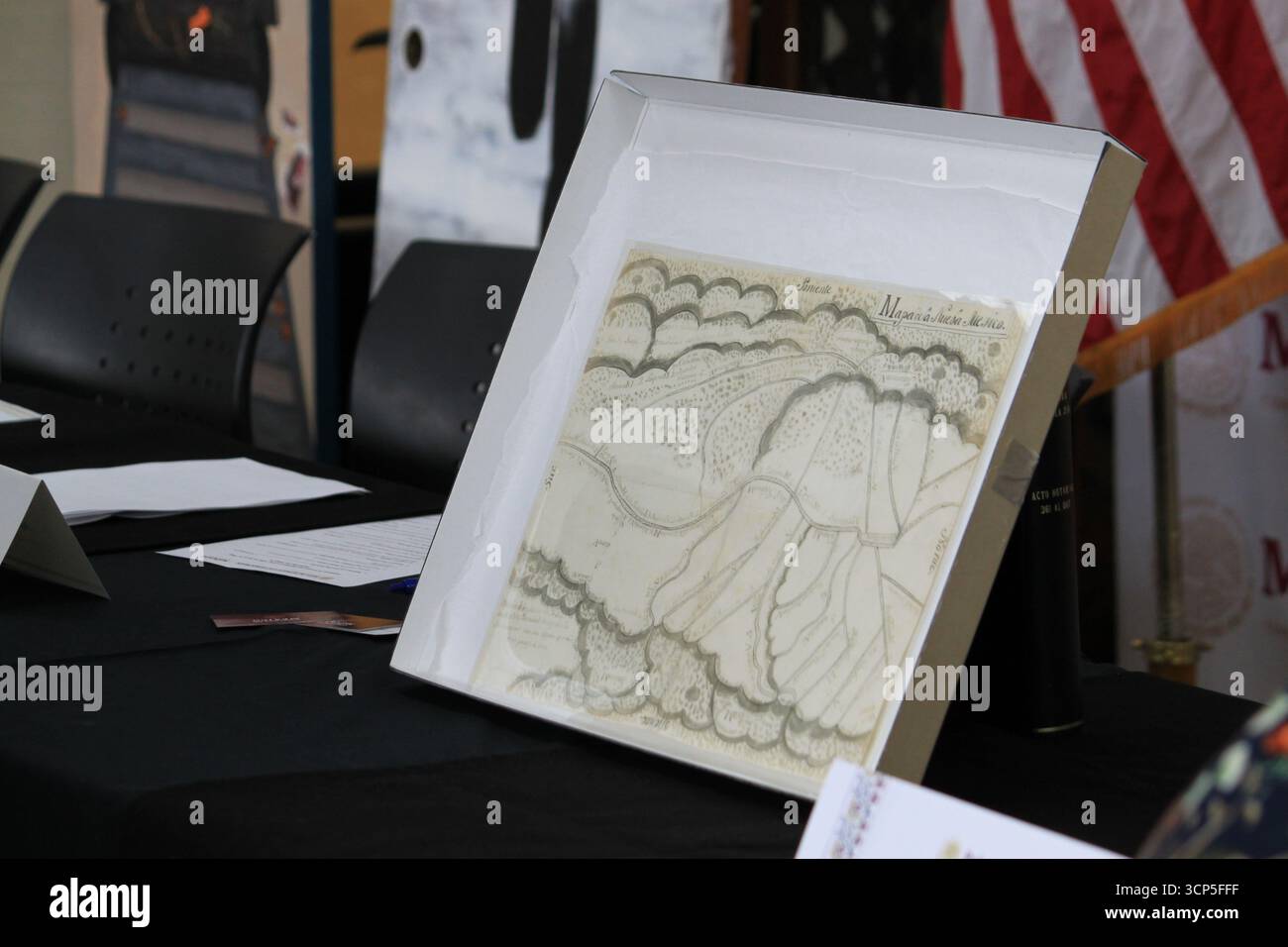 A centuries-old map is displayed before a ceremony marking its return ...