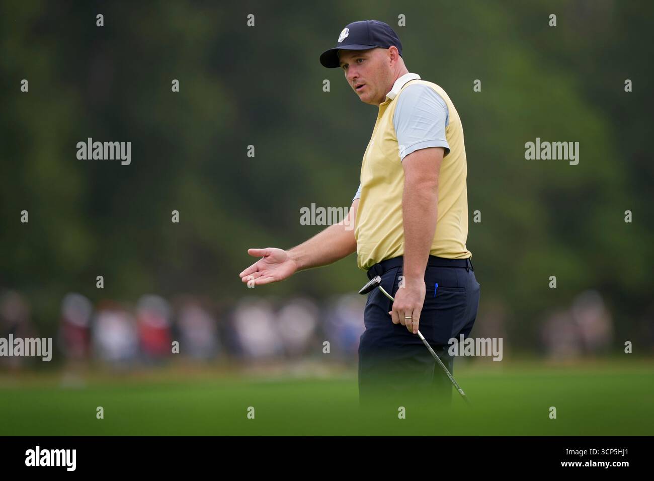 Europe's Sepp Straka reacts after missing a putt on the 12th hole ...