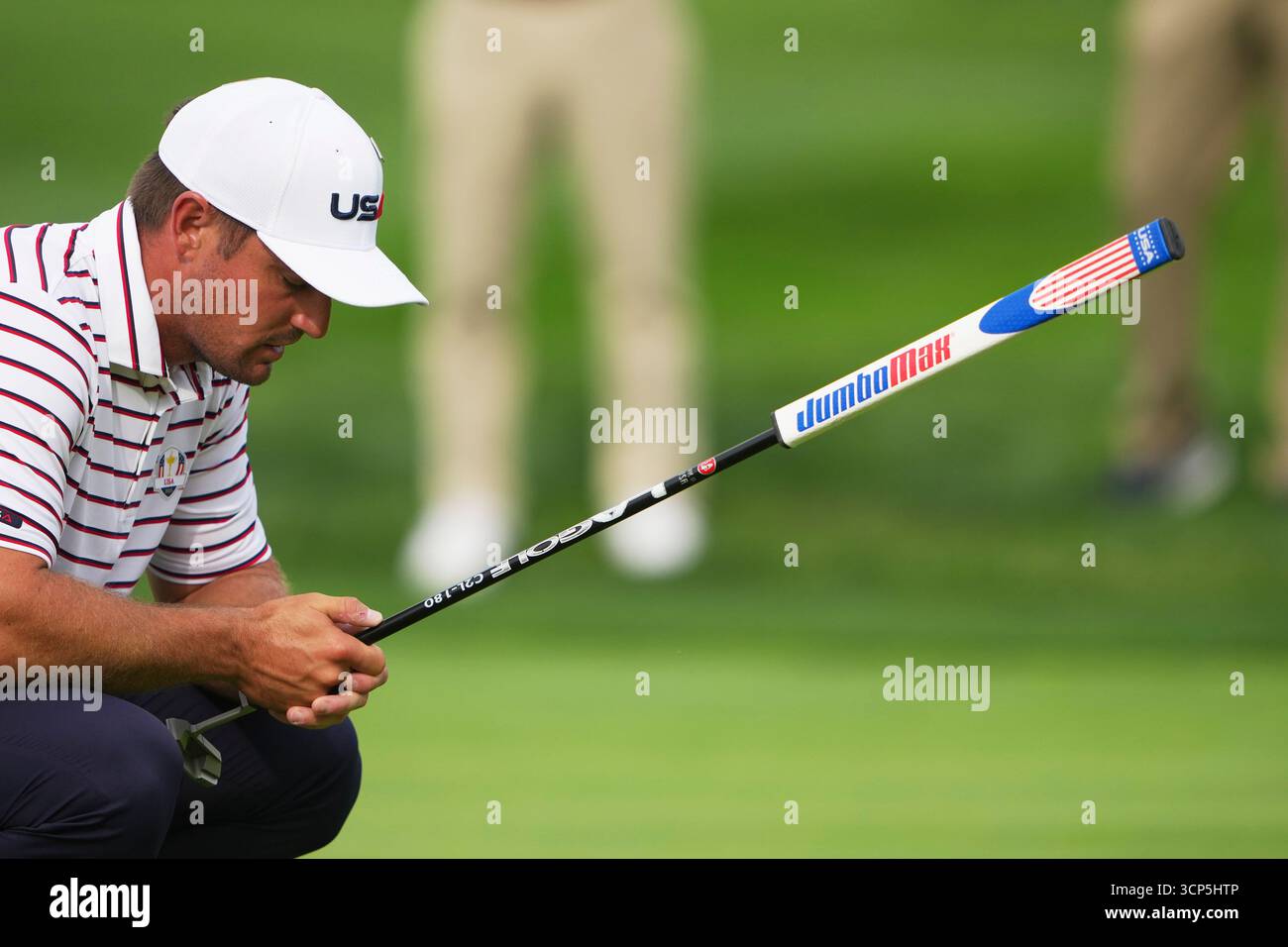 Bryson DeChambeau lines up a putt on the first hole during a practice ...