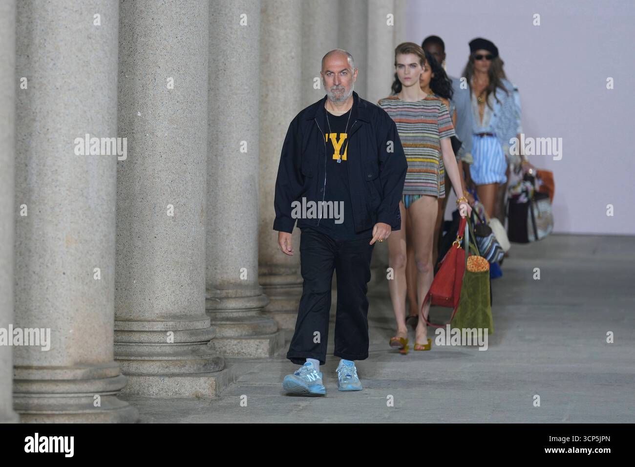 Designer Alberto Caliri leads out models after the Missoni Spring ...