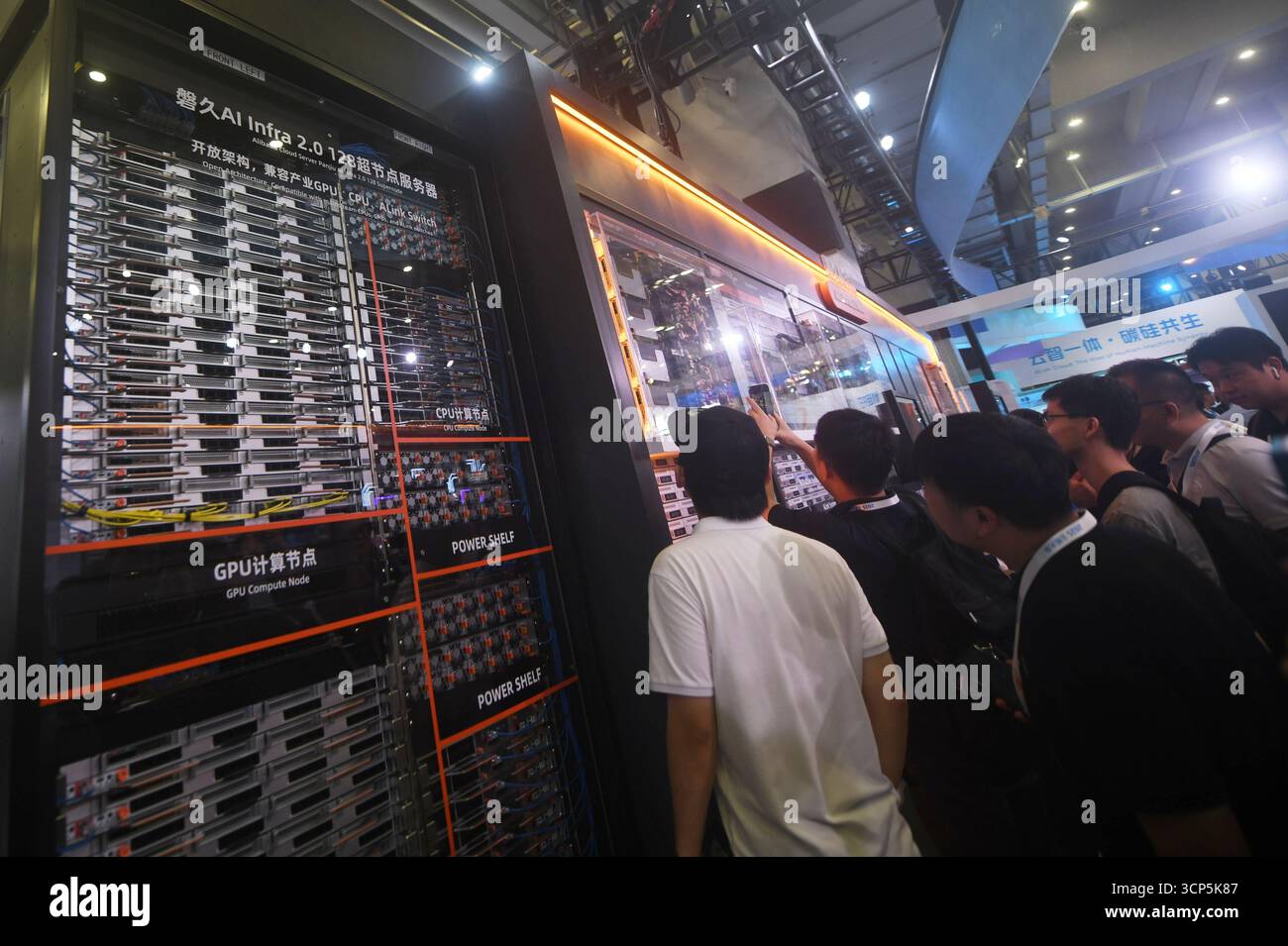 Visitors check out the Alibaba Cloud Server Panjiu AI Infra 2.0 128 Supernode exhibited at the ...