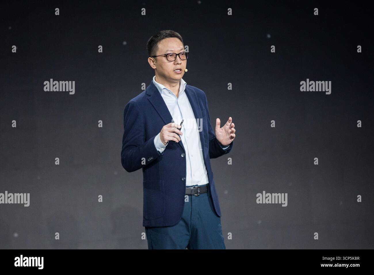 Eddie Wu Yongming, CEO of Alibaba, delivers a speech on the company's ...
