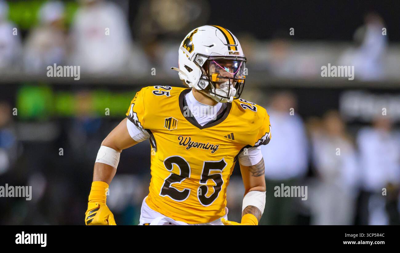 Wyoming safety Brooklyn Cheek (25) runs to make a tackle during an NCAA ...