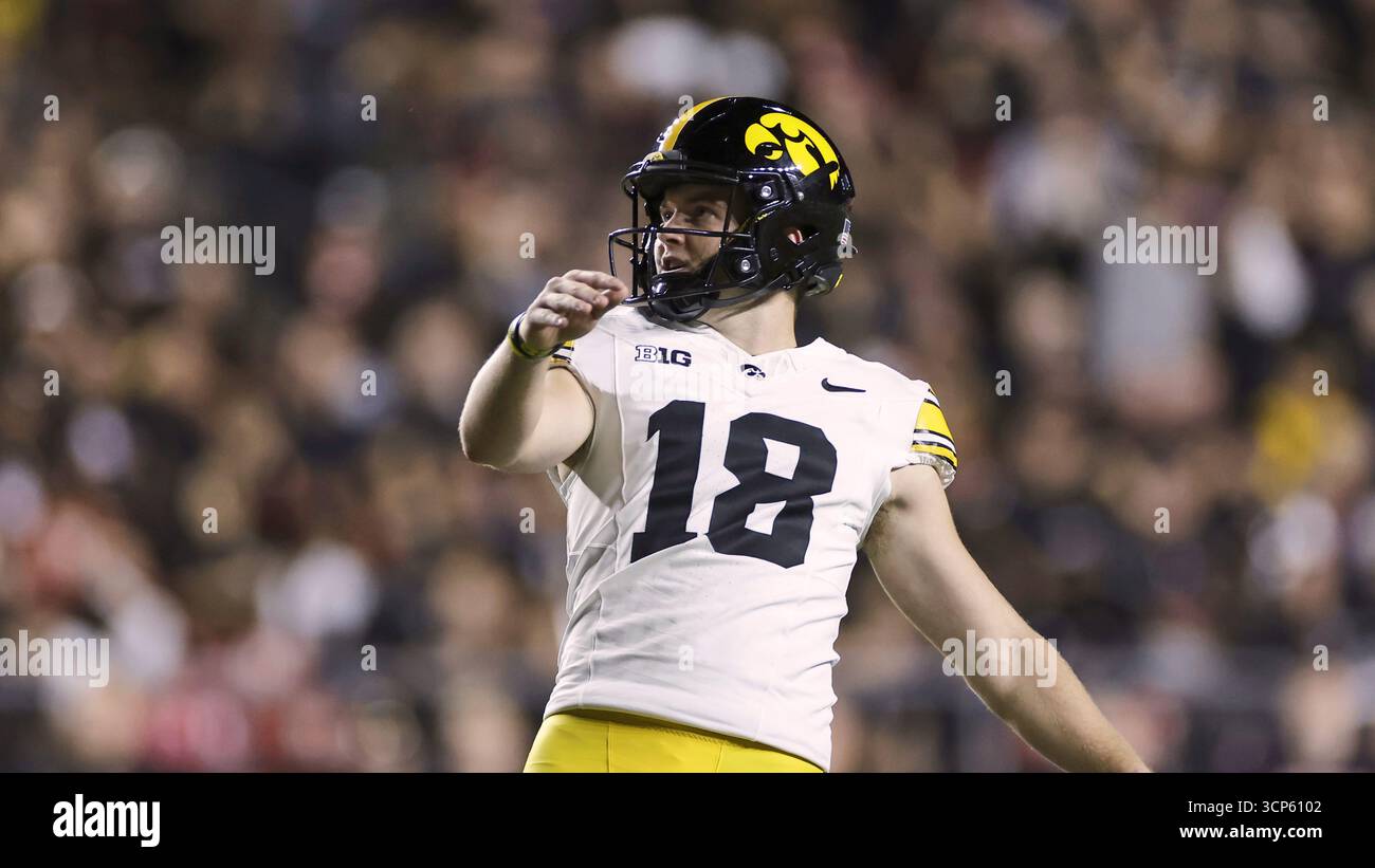 Iowa place kicker Drew Stevens (18) kicks during an NCAA football game ...
