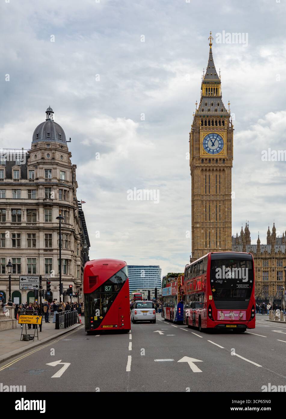 A picture of the iconic red double-decker buses in front of the Big Ben ...