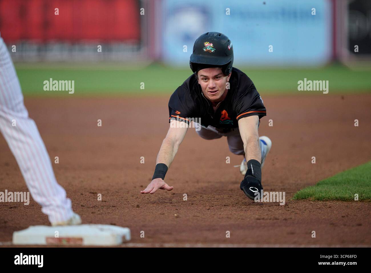 Chesapeake Baysox Austin Overn (7) slides head first into third base ...