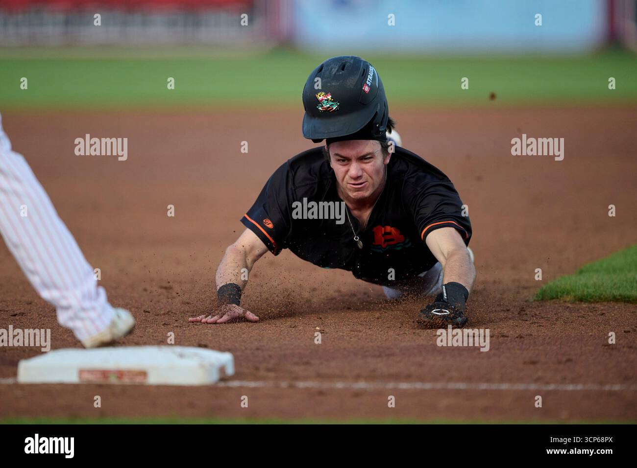 Chesapeake Baysox Austin Overn (7) slides head first into third base ...