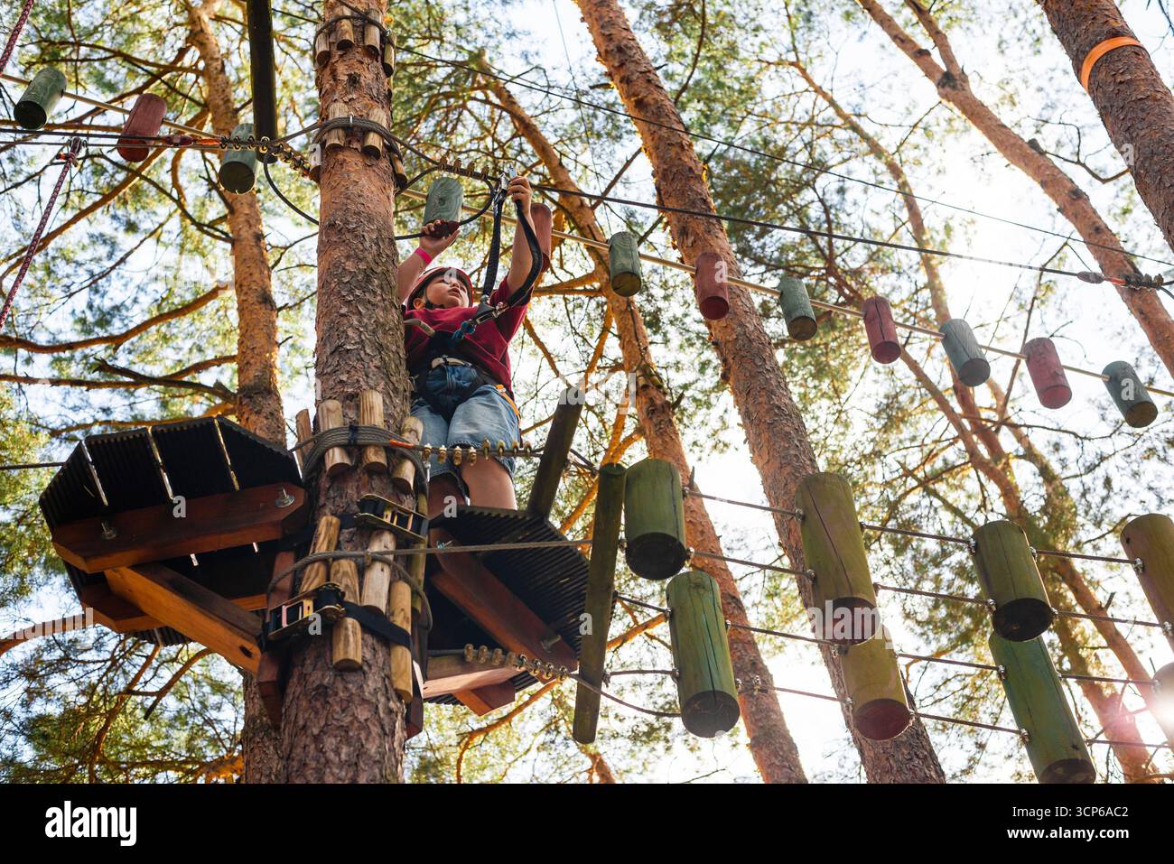 Child climbing among trees hi-res stock photography and images - Alamy