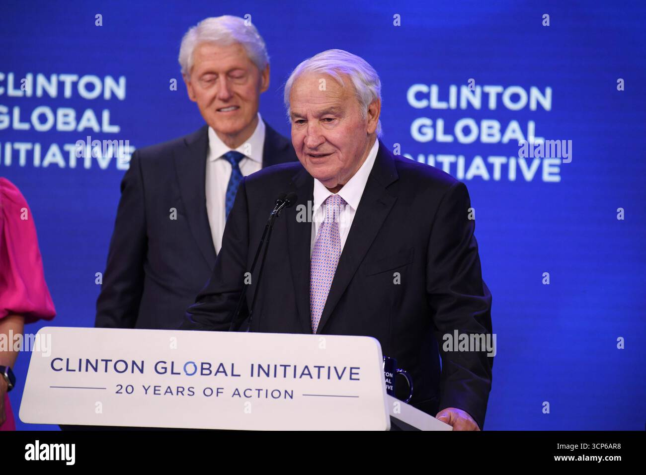 Bill Clinton and Tom Golisano onstage at the Clinton Global Initiative ...