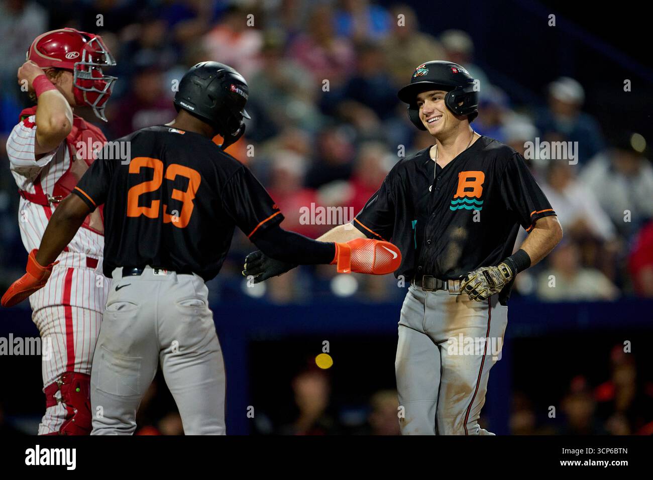 Chesapeake Baysox Austin Overn (7) celebrates with Enrique Bradfield Jr ...
