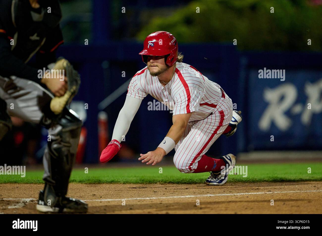 Reading Fightin Phils Nick Dunn (49) slides home head first during an ...