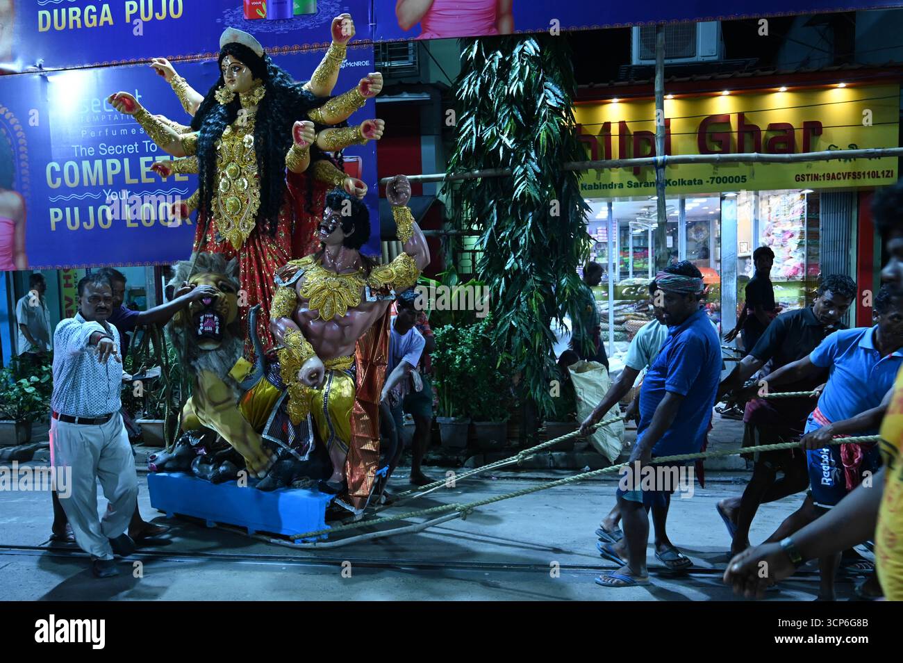 KOLKATA, INDIA - SEPTEMBER 24: Idols of Goddess Durga are transported ...