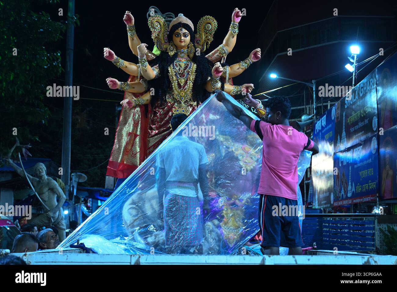 KOLKATA, INDIA - SEPTEMBER 24: Idols of Goddess Durga are covered with ...