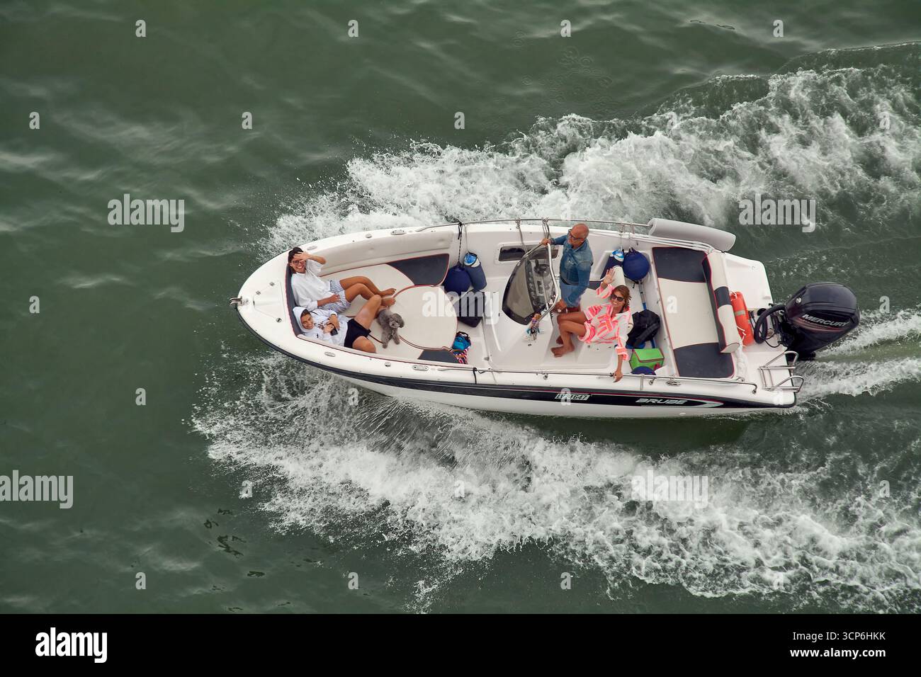 Drone captures boat cruising through hi-res stock photography and ...