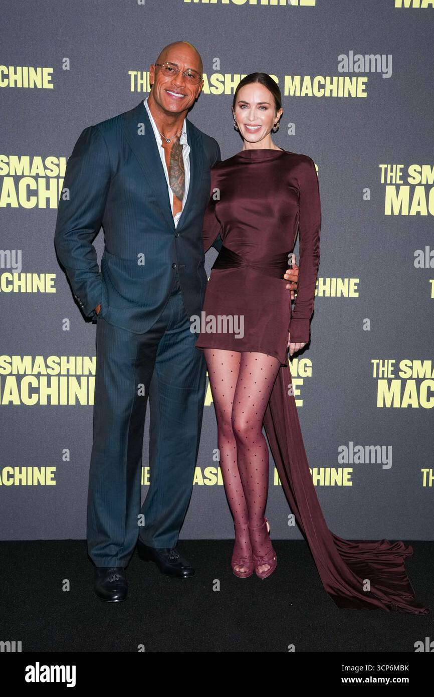 Dwayne Johnson, left, and Emily Blunt pose for photographers upon ...