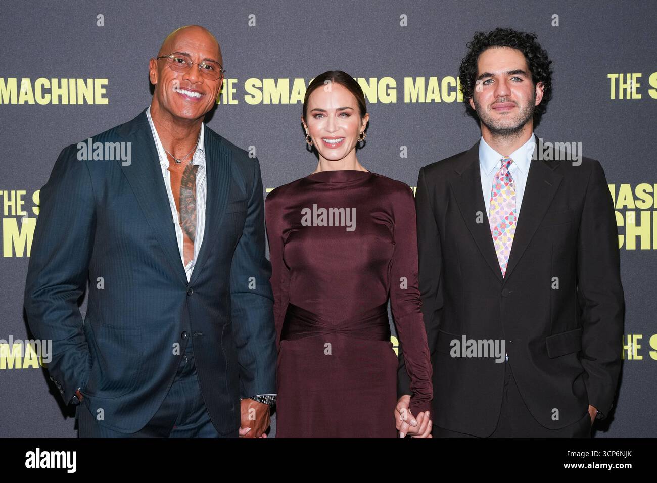 Dwayne Johnson, from left, Emily Blunt, and director Benny Safdie pose ...