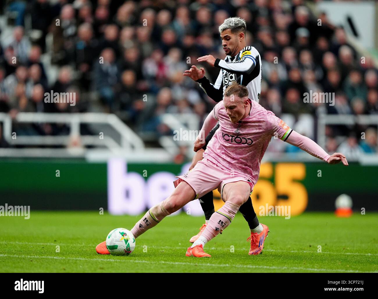 Bradford City's Ciaran Kelly and Newcastle United's Bruno Guimaraes battle for the ball during ...