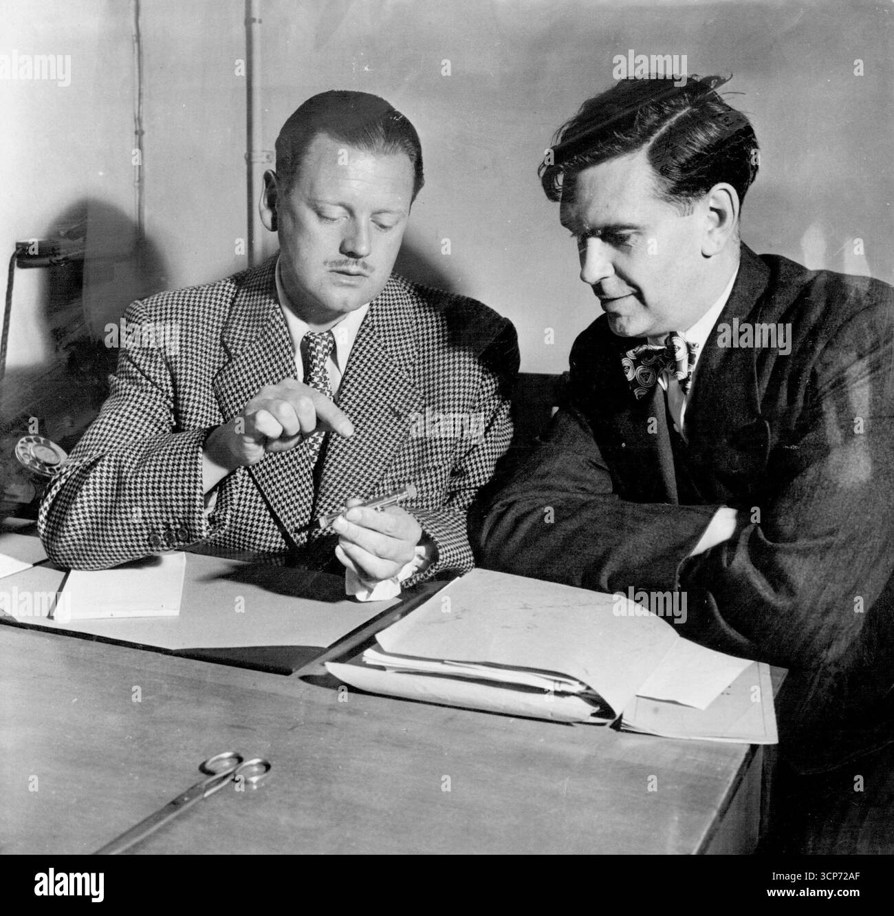 Lieutenant-Colonel Ronald Crocker (left) shows John Bull staff writer ...