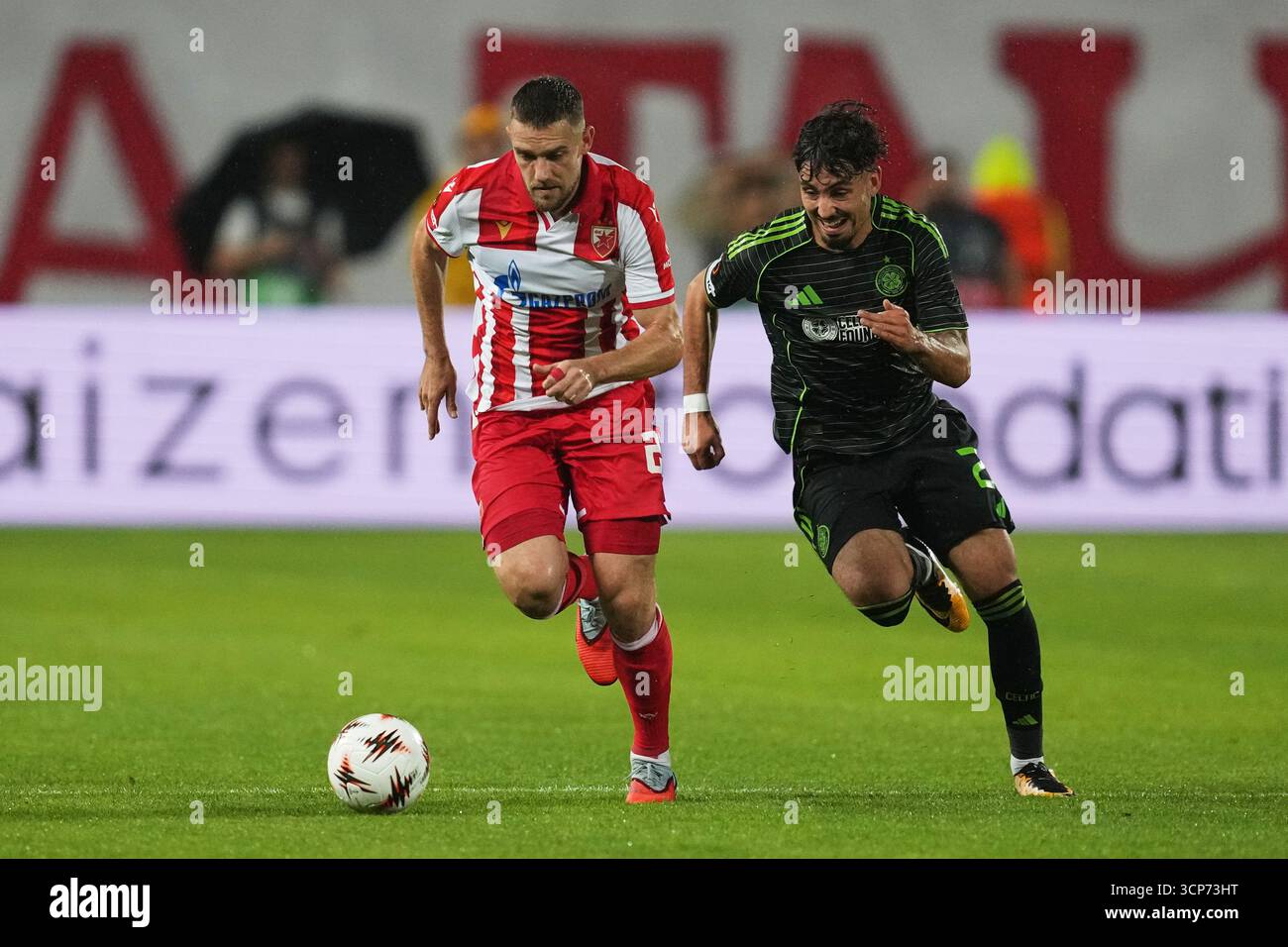 Red Star's Timi Max Elsnik, left, challenges for the ball with Celtic's ...