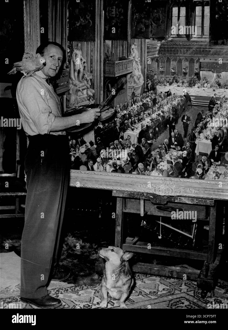Mr. Terence Cuneo, his parrot perched on his shoulder, with his picture ...