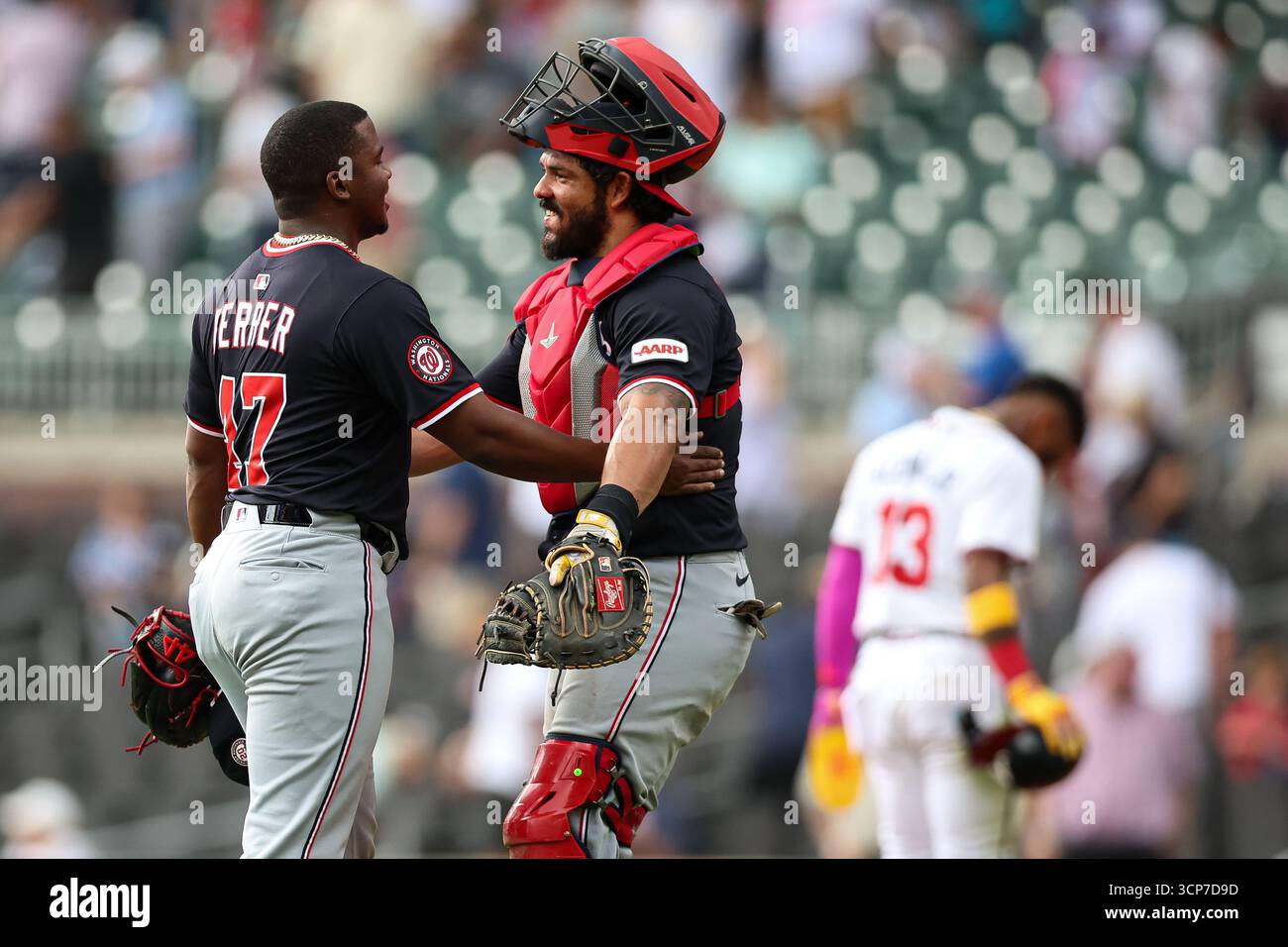 Washington Nationals pitcher Jose A. Ferrer, left, hugs catcher Jorge ...