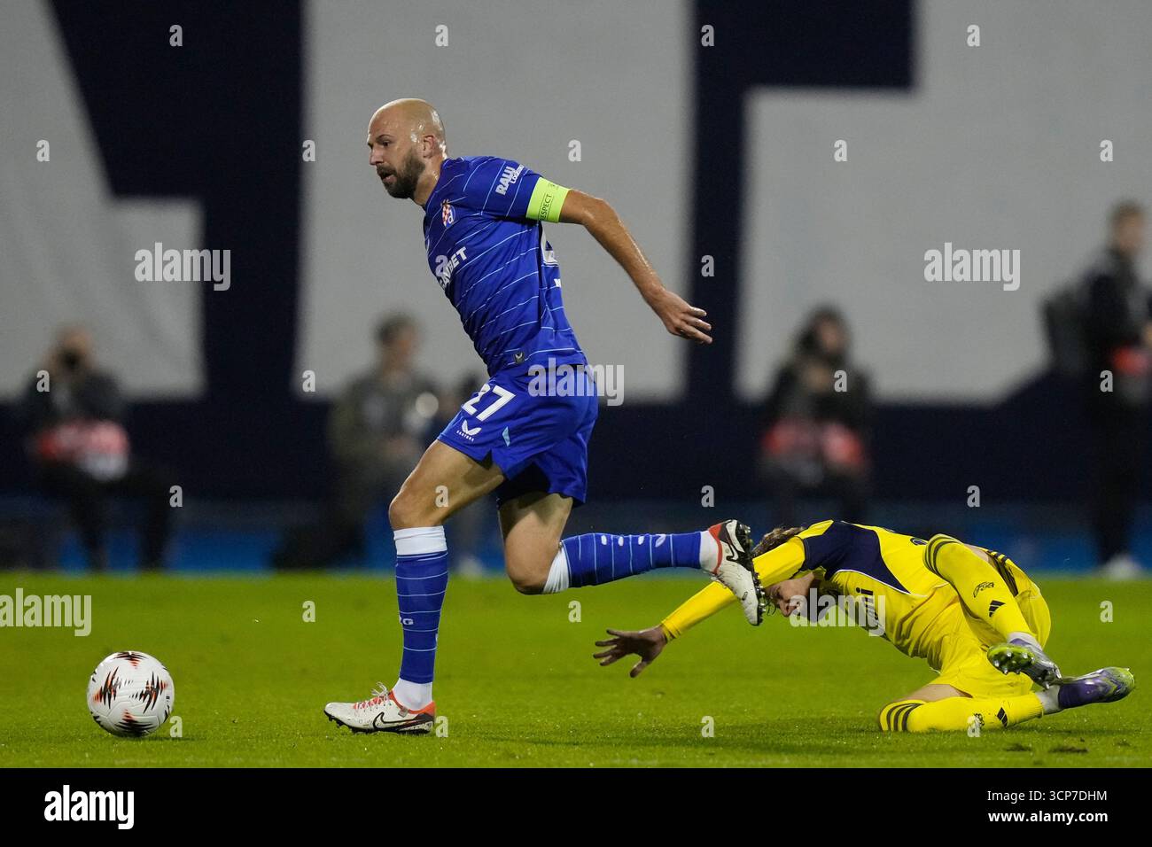 Dinamo's Josip Misic, left, runs with the ball as Fenerbahce's Archie ...