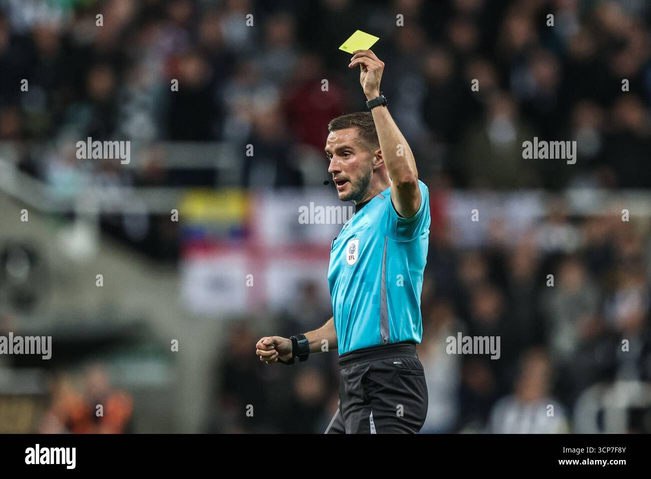 Referee Thomas Kirk gives a yellow card to Tommy Leigh of Bradford City ...