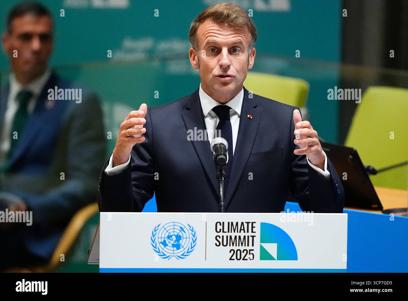 French President Emmanuel Macron speaks during a climate summit ...