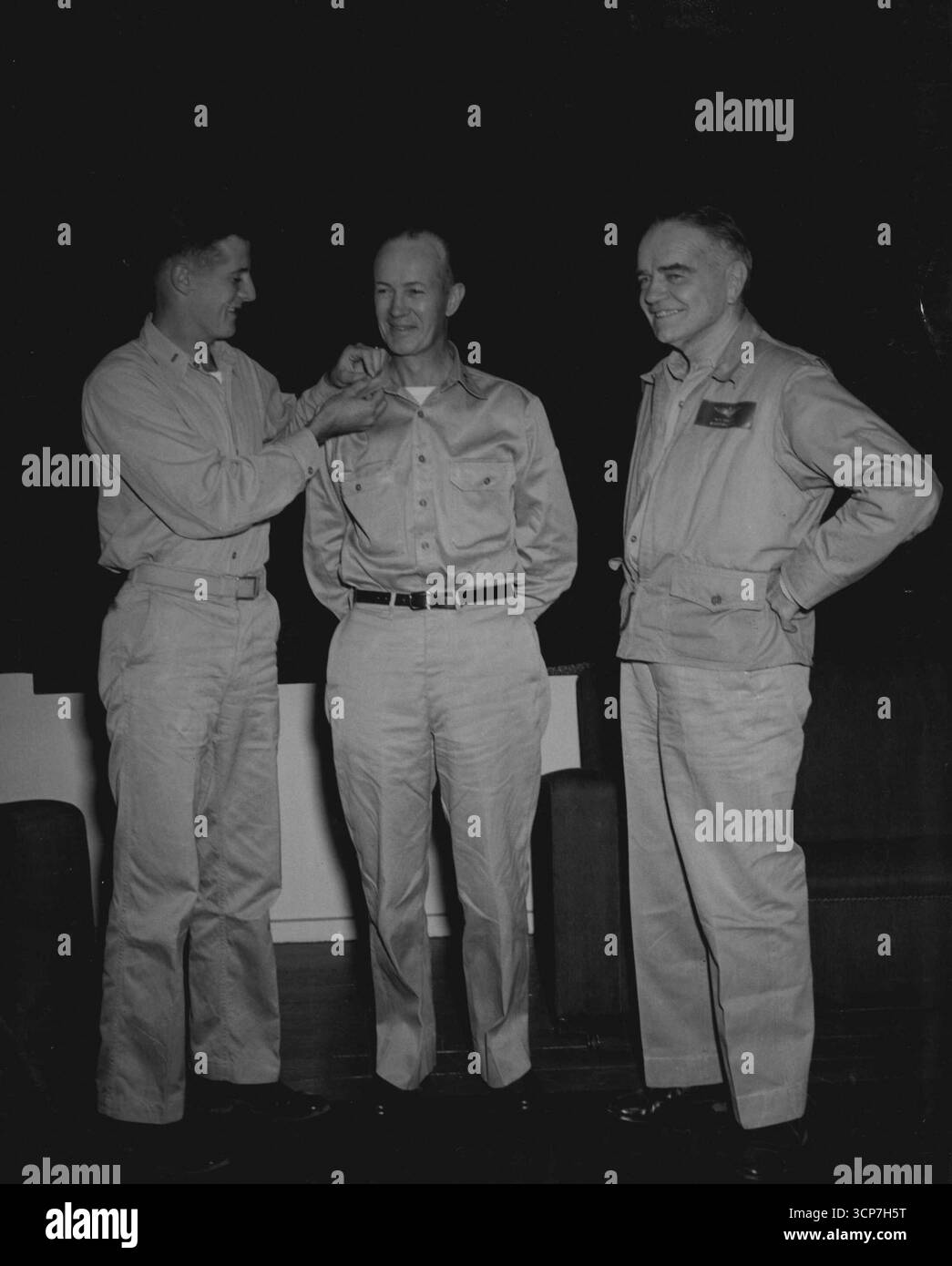 Rear Admiral Robert B. Carney, USN, (Center) smiles with good reason as ...
