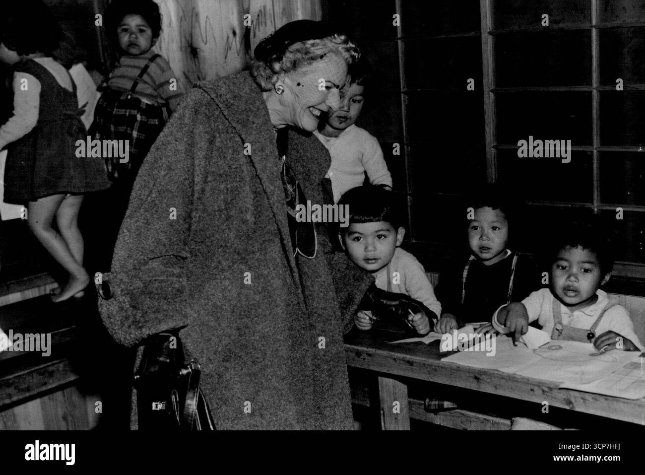 Mrs. Mark W. Clark, Wife of General Clark, Cincfe, visits with orphans ...