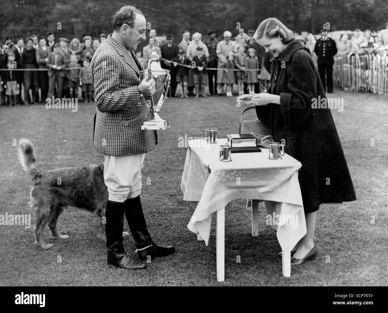 Lady Cowdray presents the cup to her husband, Lord Cowdray, when ...