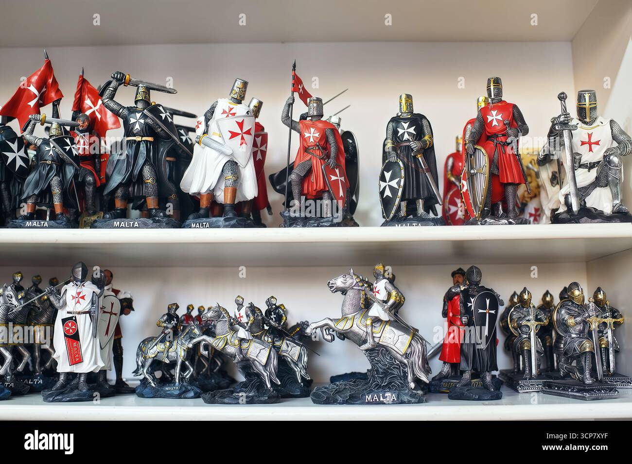 Souvenir figurines of Maltese knights in armor with swords, shields ...