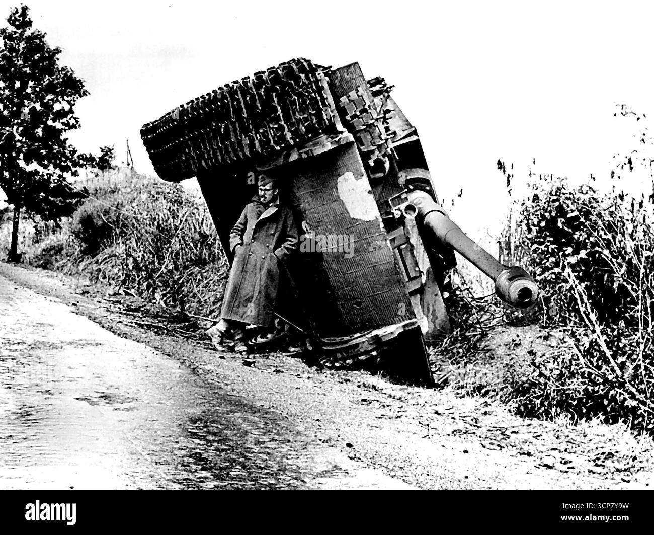 Kncked-Out German Equipment In Italy A British soldier shelters from ...