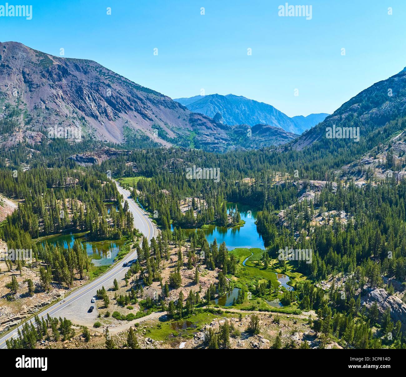 Aerial Tioga Lake Sierra Nevada Mountain Forest and Winding Road ...