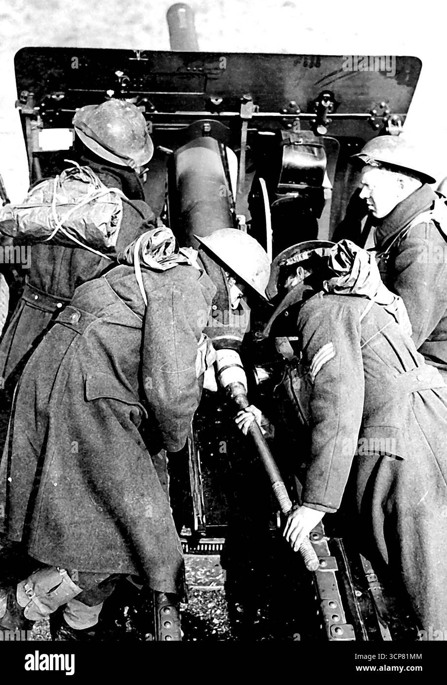 Artillerymen Stage Mimic Battle -- A gun team loading A 25-Pounder gun ...