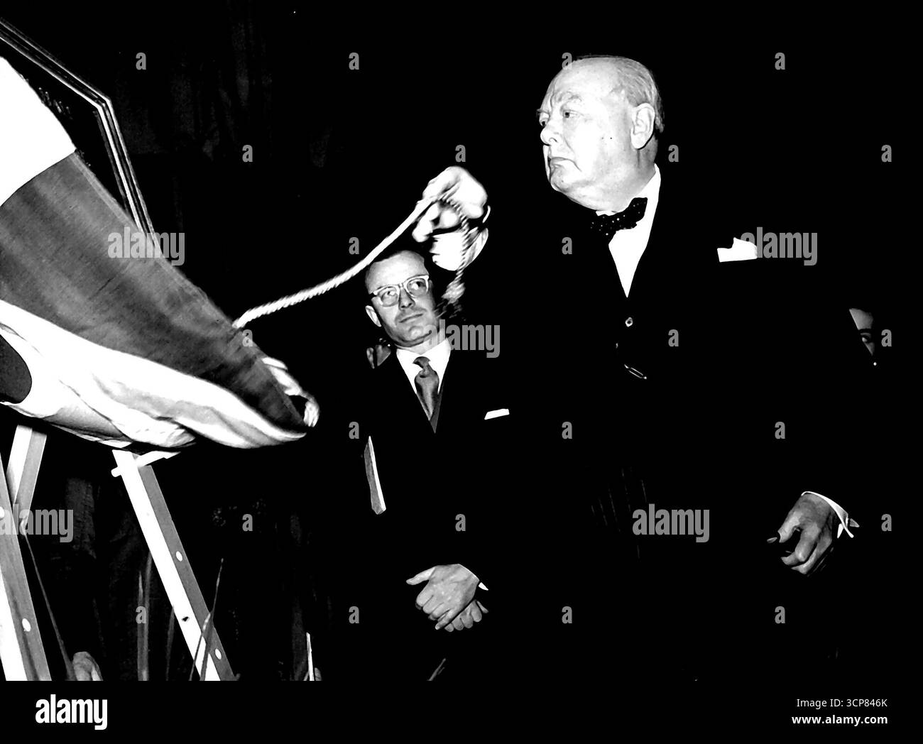 Sir Winston Opens New Community Hall -- Sir Winston Churchill unveiling the plaque to Sir James ...