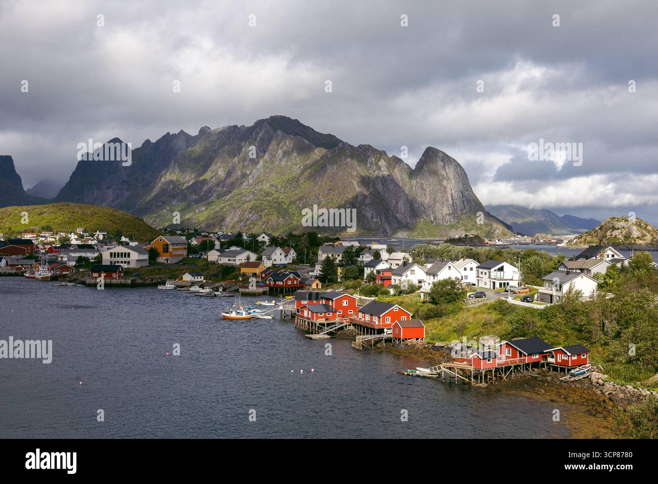 Reine fishing village with traditional red rorbu cabins along the ...