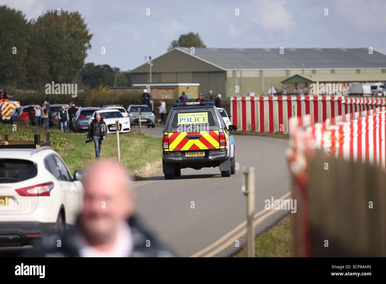 Royal Air Force police patrol the perimeter fence at RAF Coningsby ...
