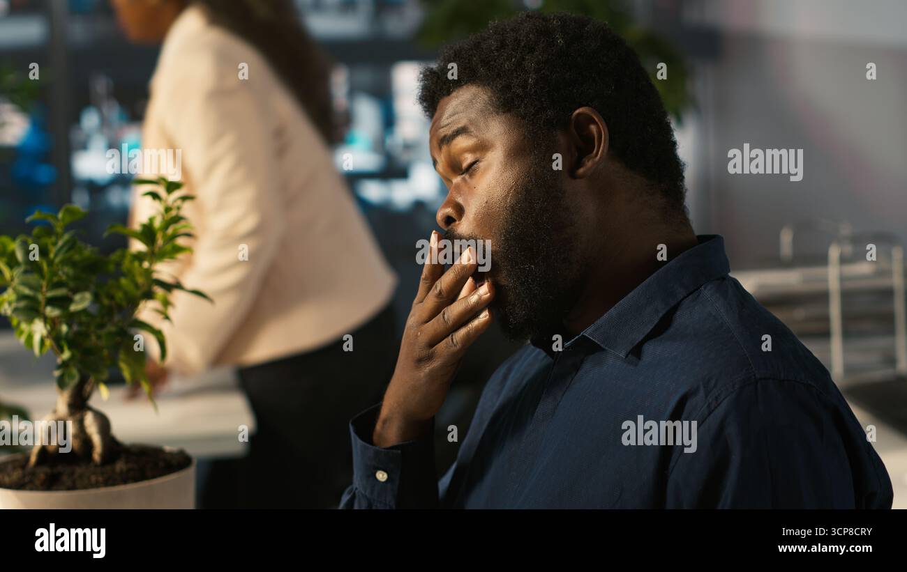 Worker in office reviewing financial graphs, analyzing business ...