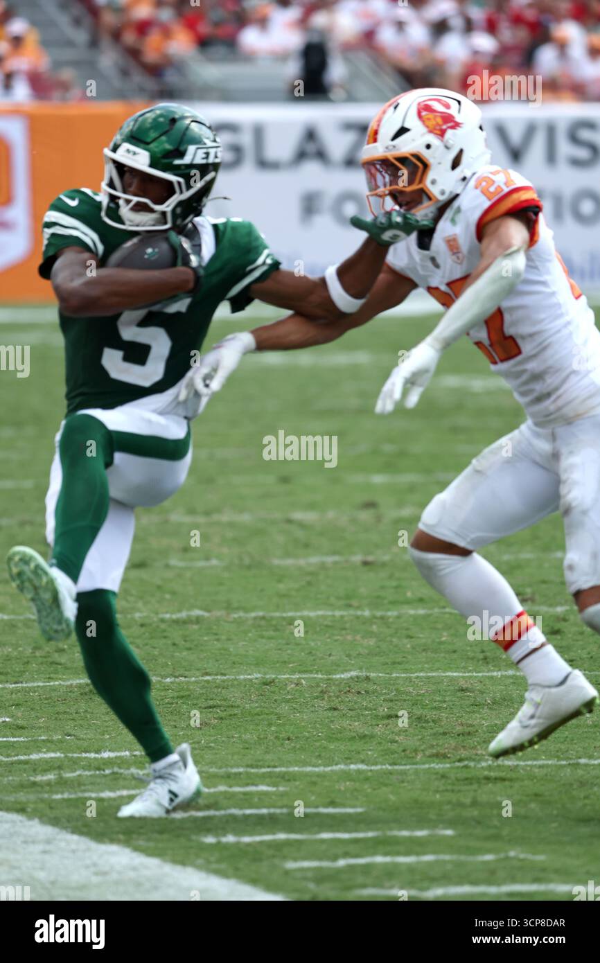 New York Jets wide receiver Garrett Wilson (5) is knocked out of bounds ...