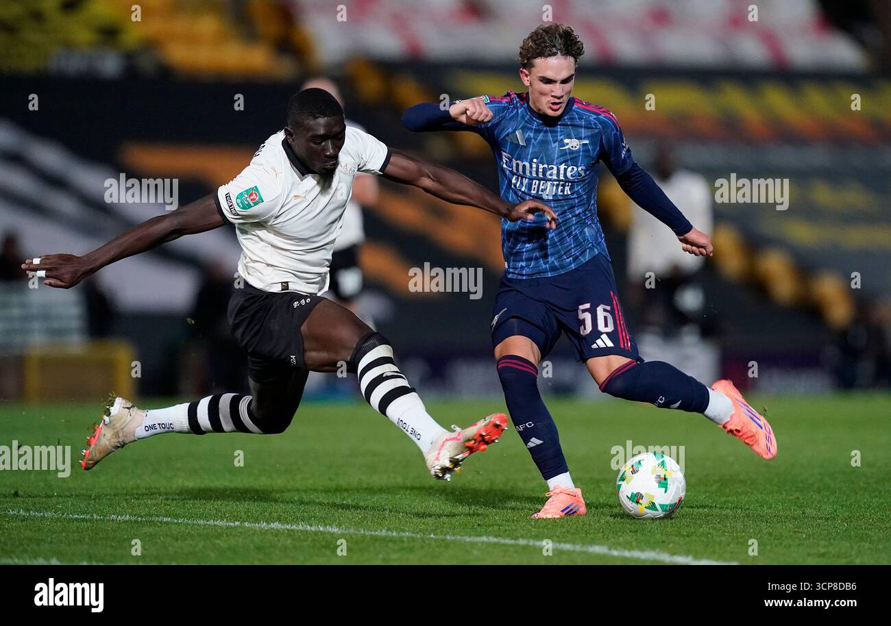 Burslem, England, 24th September 2025. Max Dowman of Arsenal (R) has ...