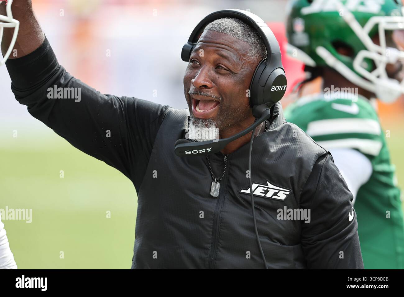 New York Jets head coach Aaron Glenn walks the sidelines during an NFL ...