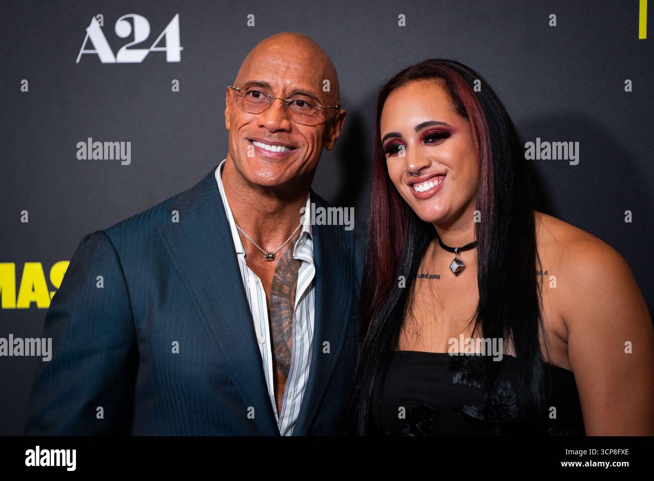 Dwayne Johnson, left, and Ava Raine pose for photographers upon arrival ...