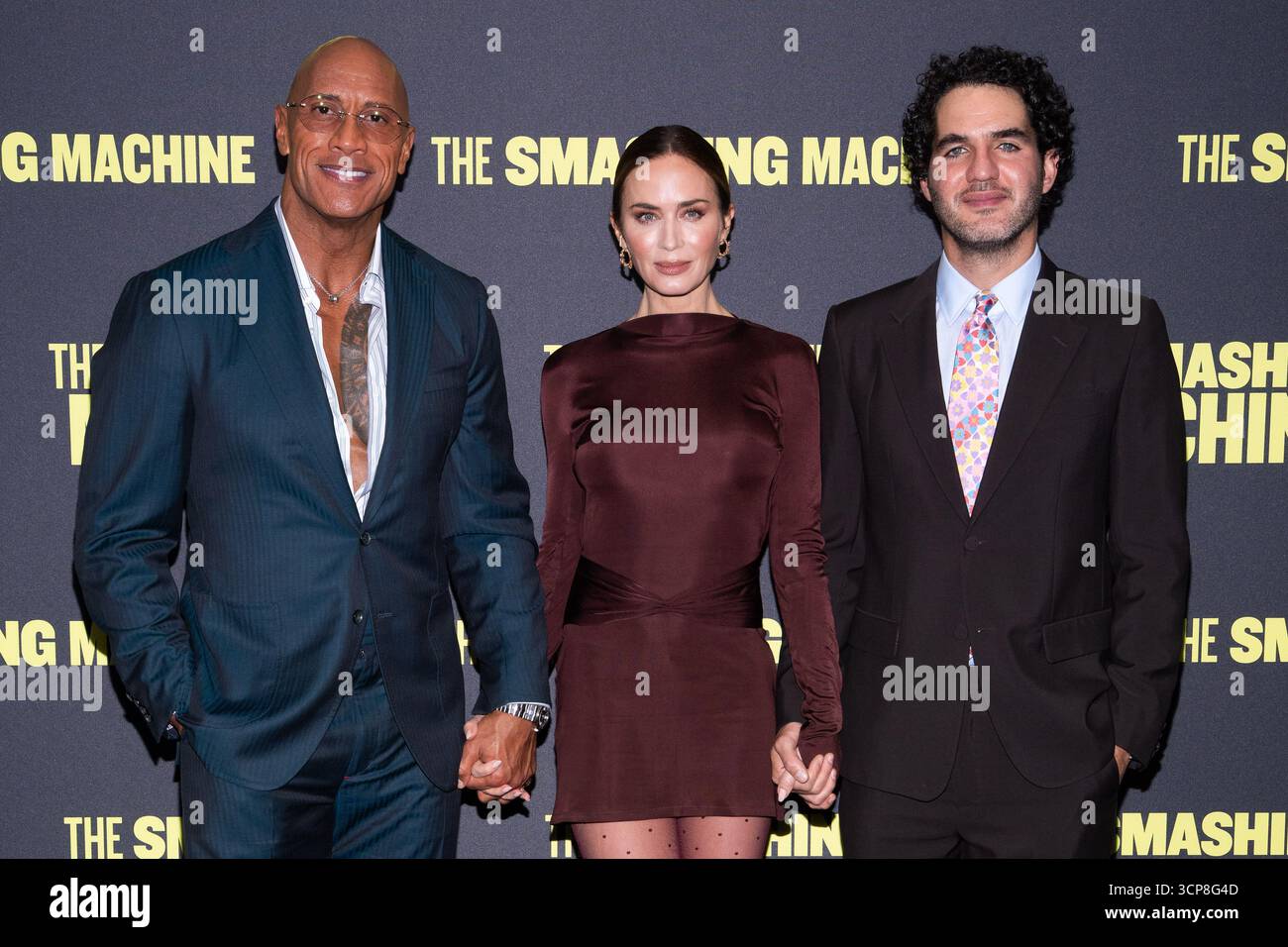 Dwayne Johnson, left, Emily Blunt and Benny Safdie pose for ...