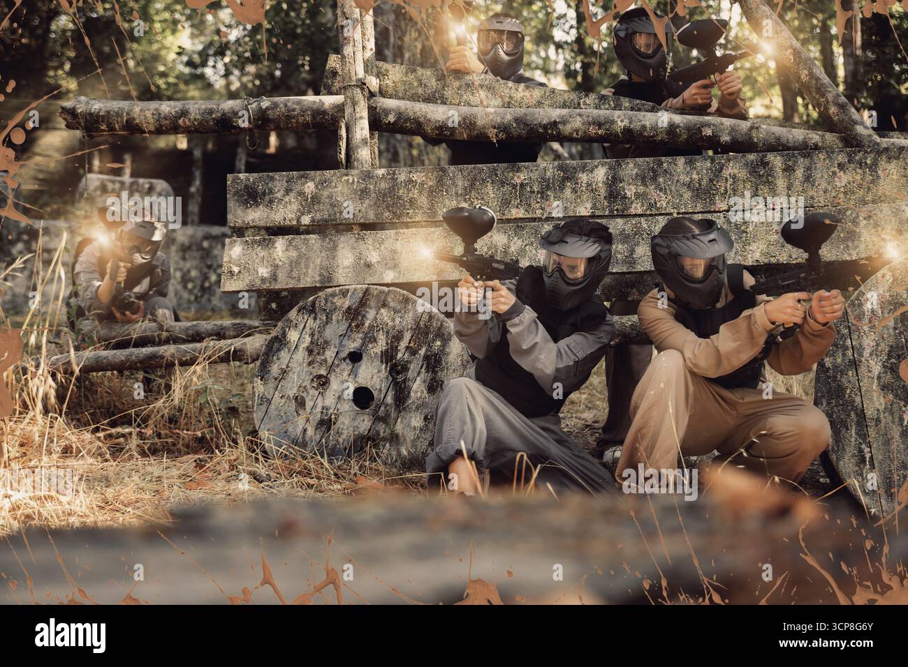 Tactical paintball team fighting on outdoor location Stock Photo - Alamy