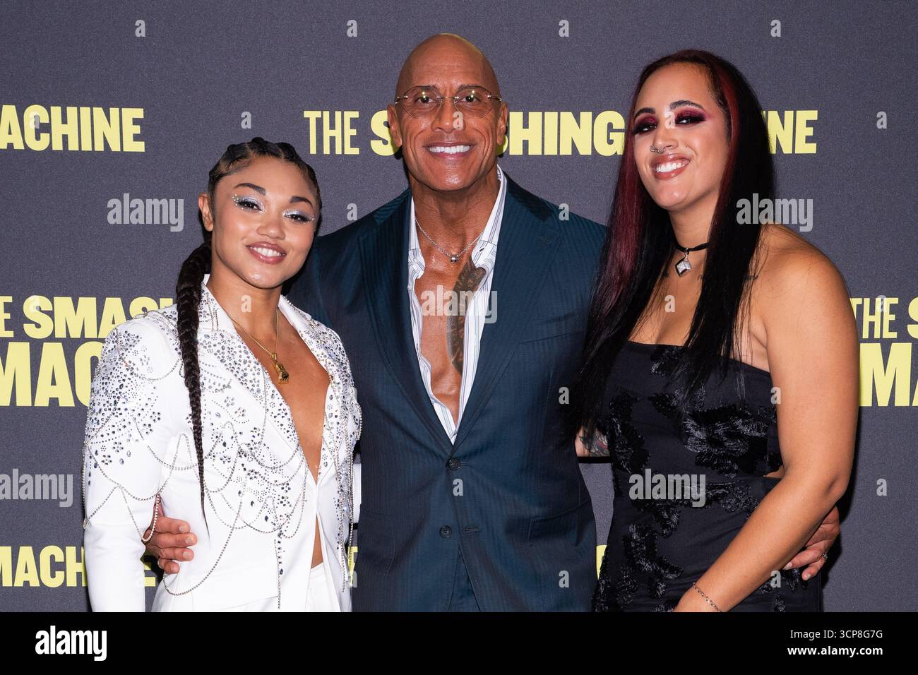 Tatyanna Dumas, from left, Dwayne Johnson and Ava Raine pose for photographers upon arrival at ...