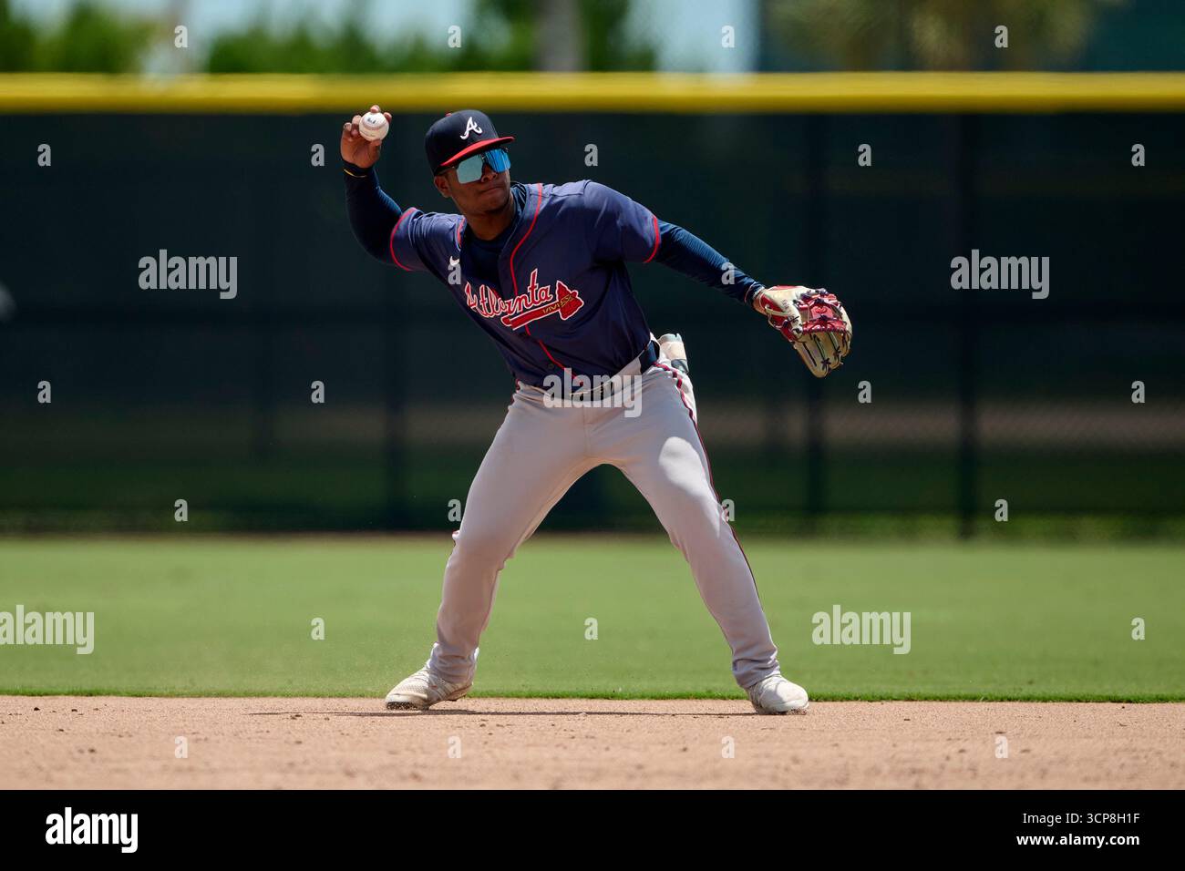 Atlanta Braves second baseman Mario Baez (45) throws to first base ...