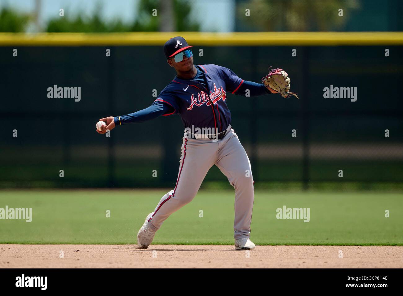 Atlanta Braves second baseman Mario Baez (45) throws to first base ...